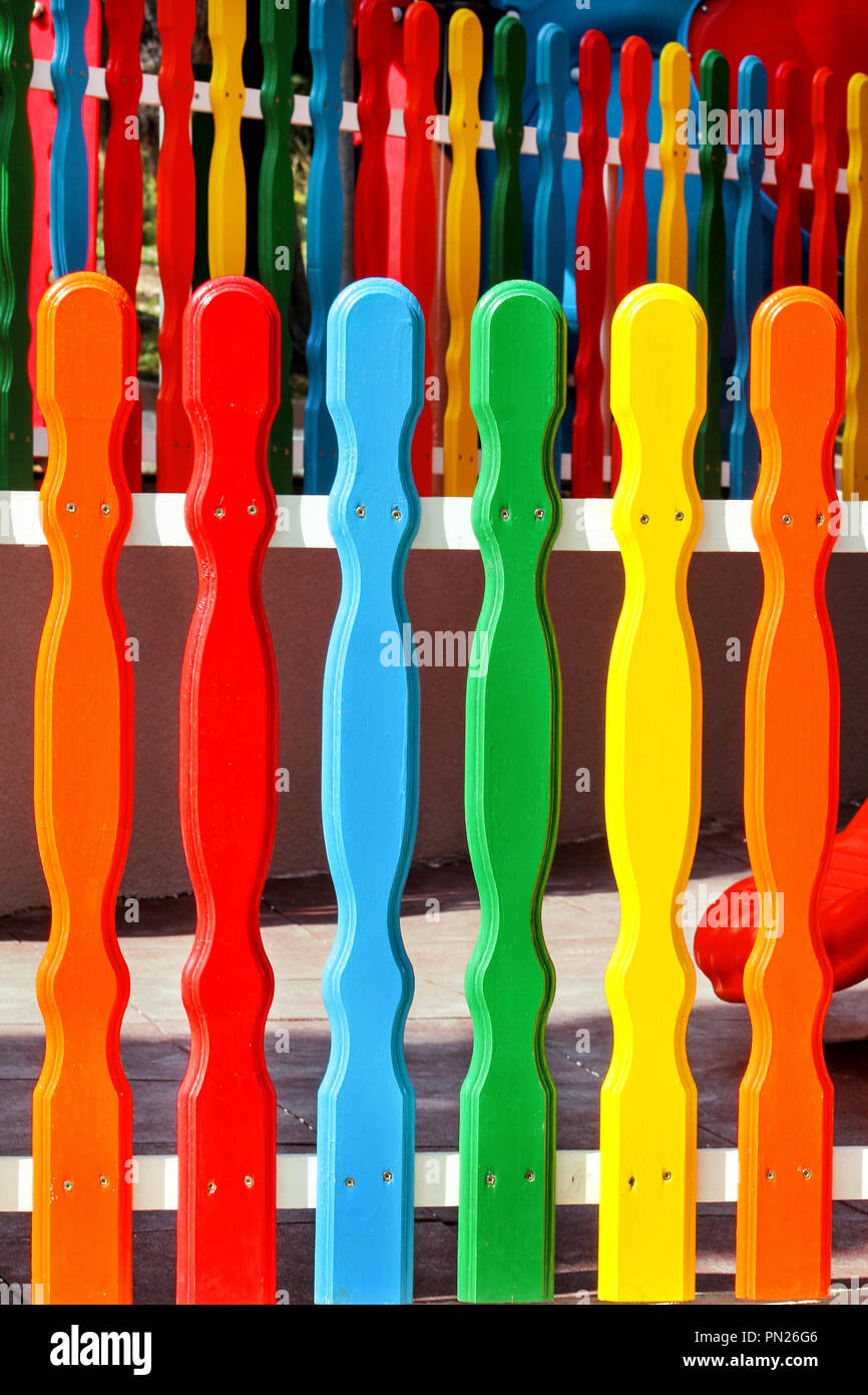 Colorful wooden decorative fence in the city park. Landscape ...