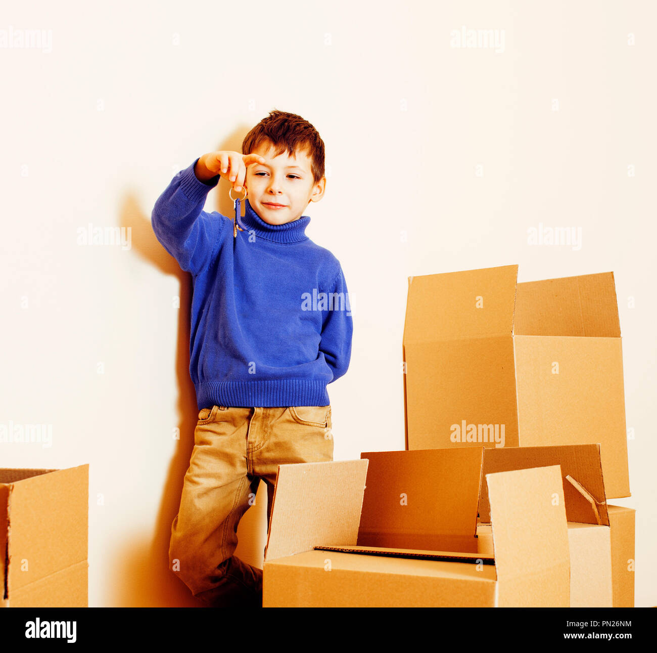 little cute boy in empty room, remove to new house. home alone Stock ...