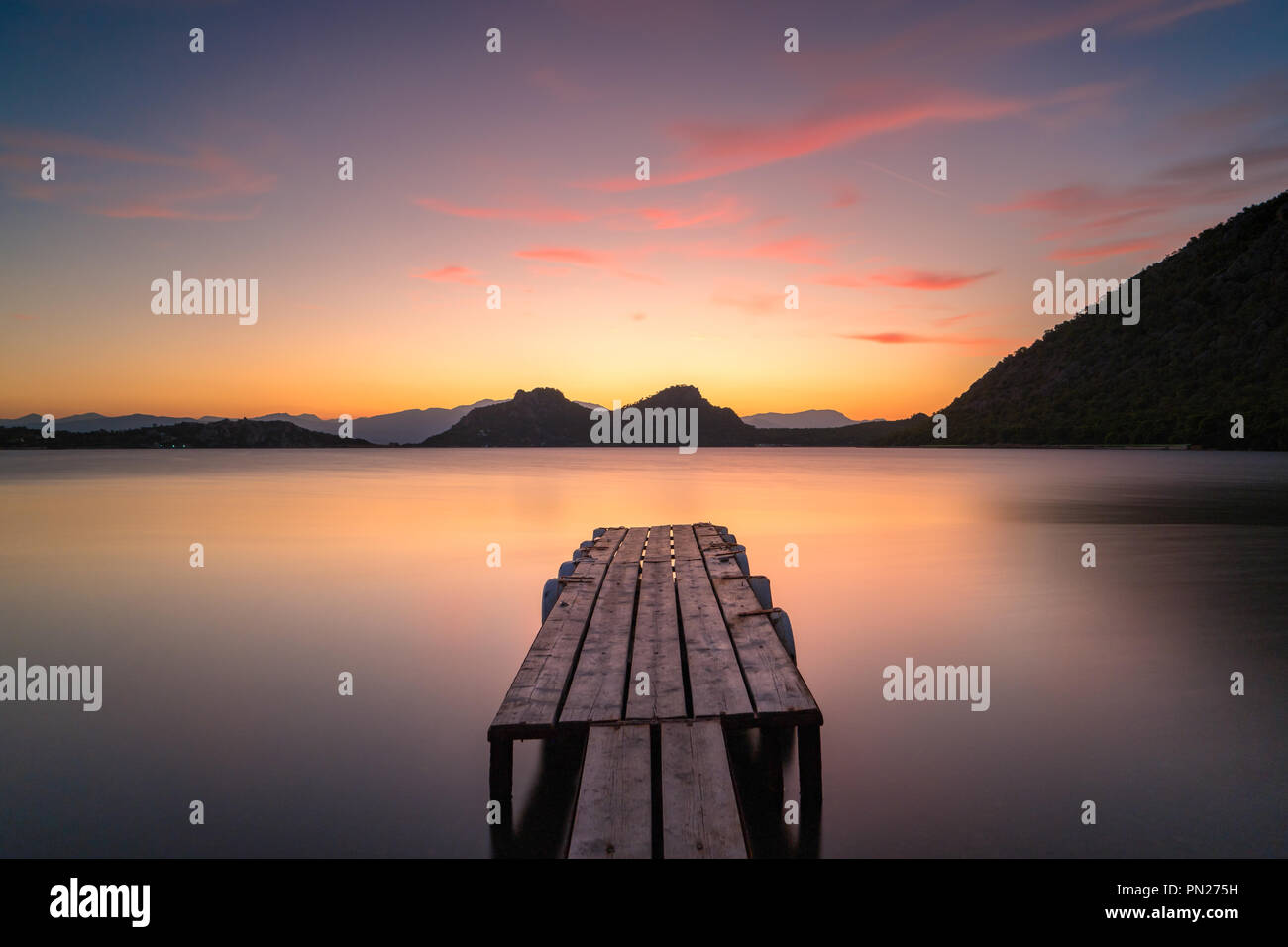 Golden hour sunset on a deck Stock Photo - Alamy