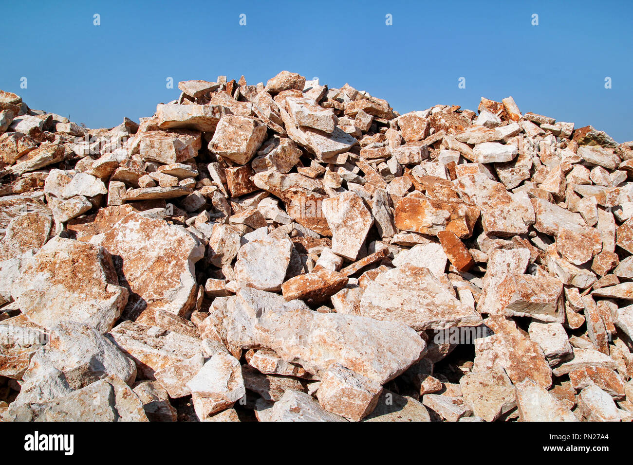 Brown Granite. Big pile of rocks for construction and boulders piled in ...