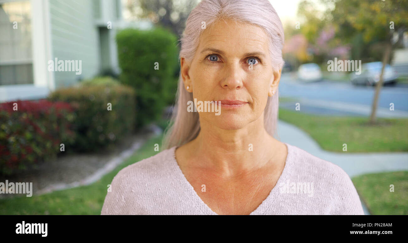 An older woman in her suburban neighborhood Stock Photo - Alamy