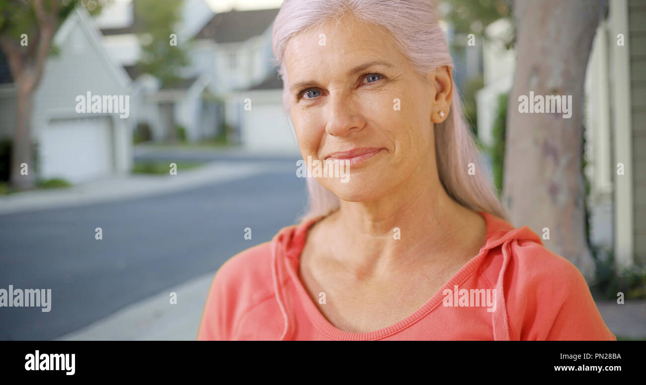 An older woman in her suburban neighborhood Stock Photo - Alamy