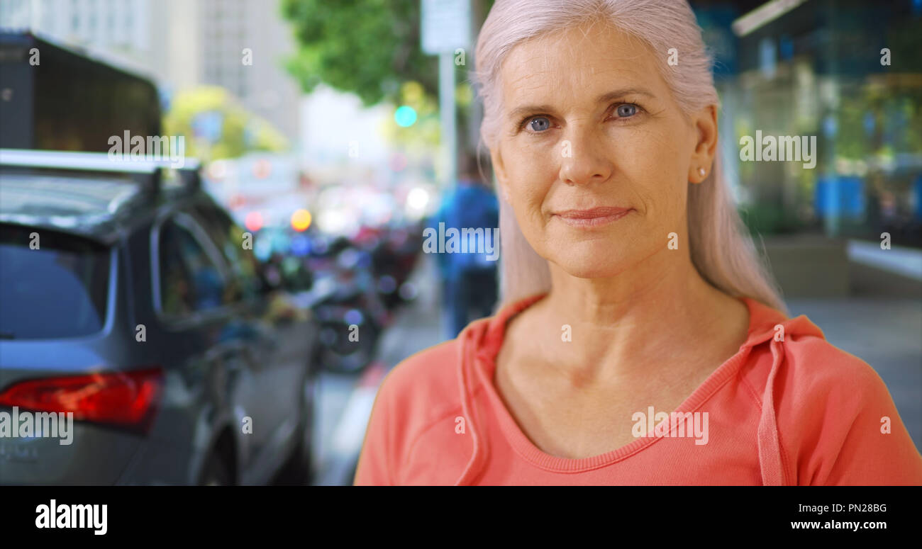 An older woman stands on a San Francisco street corner Stock Photo - Alamy