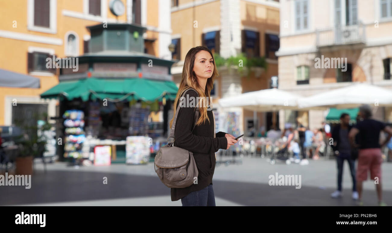 Caucasian girl in her 20s using cellphone for directions Stock Photo ...