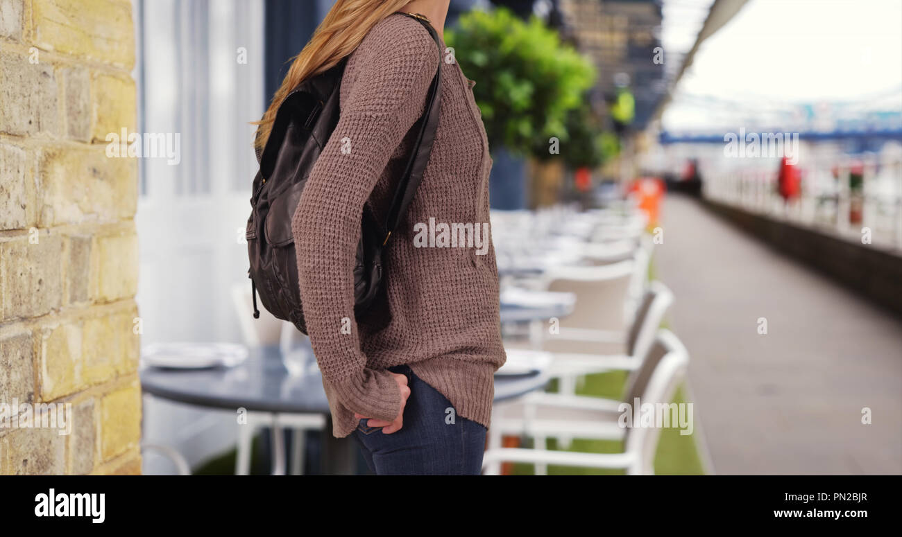 London girl in her 20s with her backpack on urban street Stock Photo ...