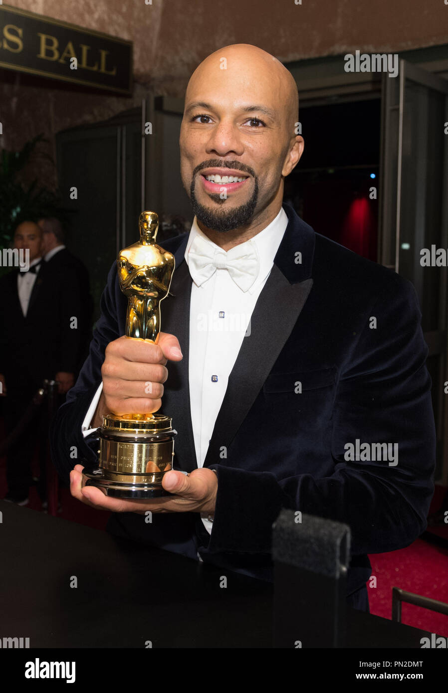 Lonnie Lynn (Common) poses with guests and the Oscar® for Achievement ...