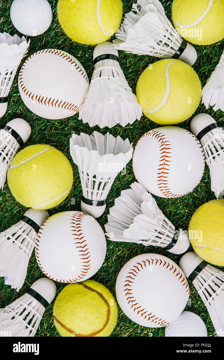 top view of arrangement of badminton shuttlecocks, tennis and baseball ...