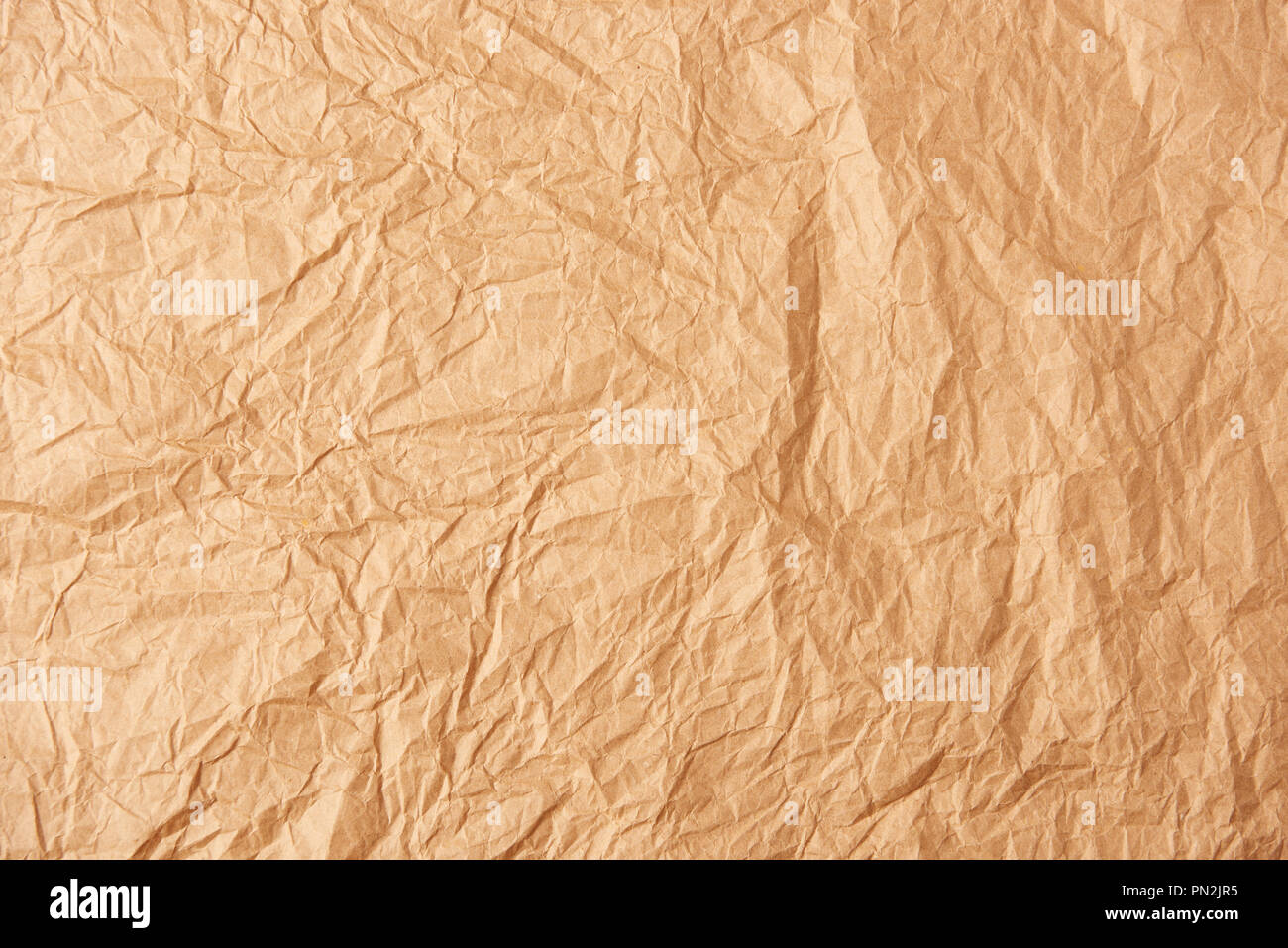 full frame of beige crumpled paper as background Stock Photo - Alamy