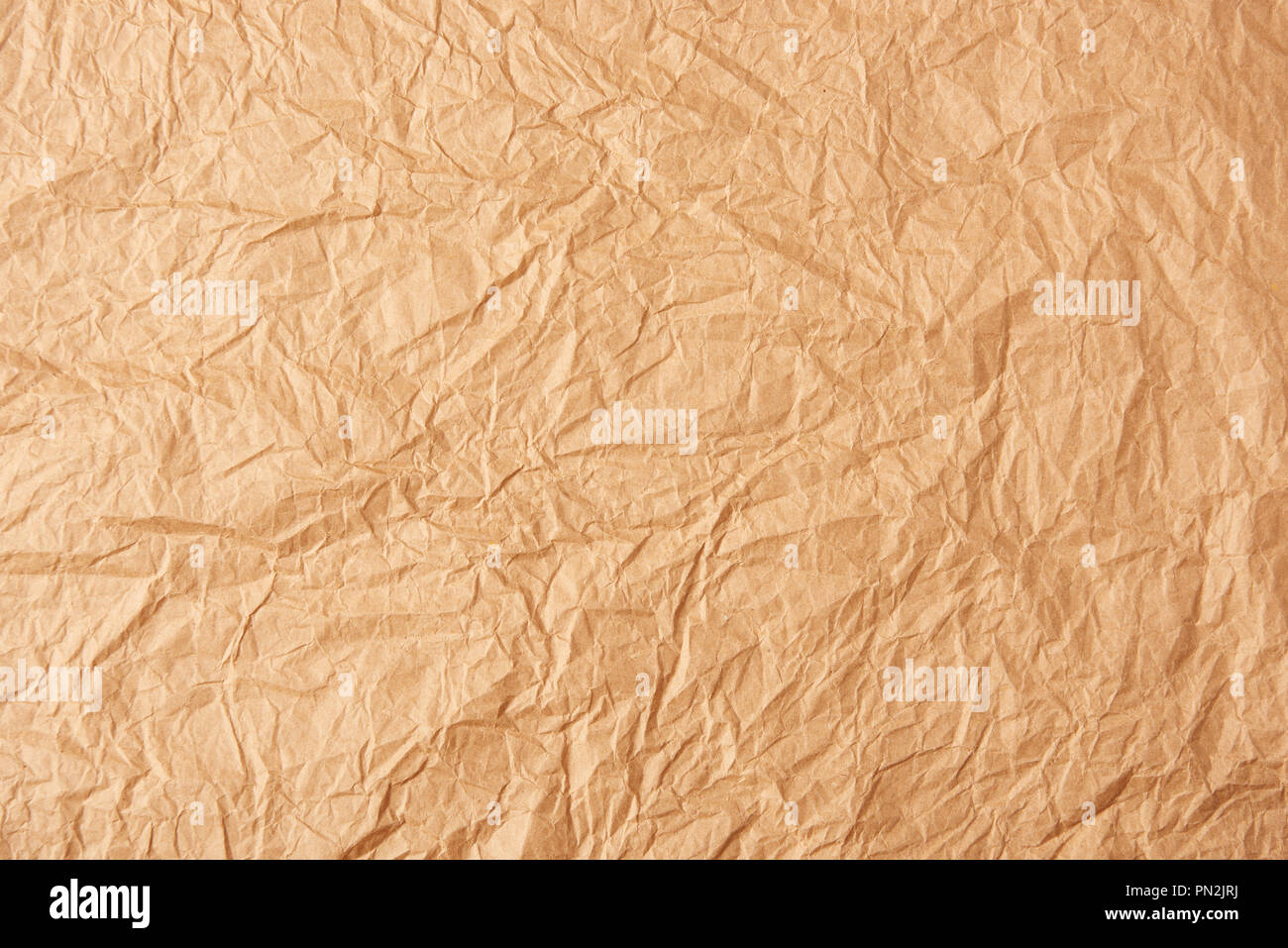full frame of beige crumpled paper as background Stock Photo - Alamy