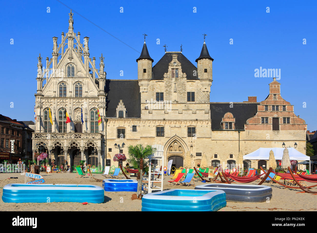 The medieval town hall with belfry at the market square during ...