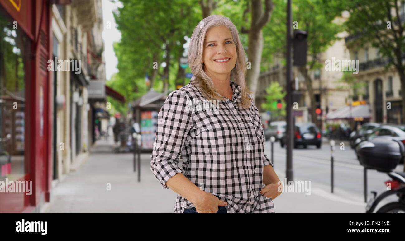Strong independent woman stands boldly on a Paris sidewalk Stock Photo ...