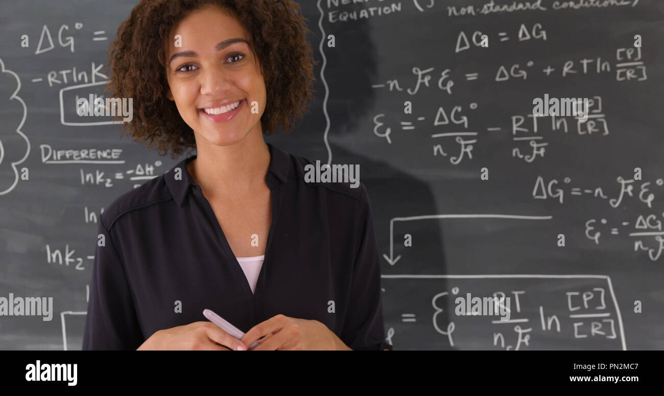 Portrait of black teacher giving math lesson on chalkboard Stock Photo ...