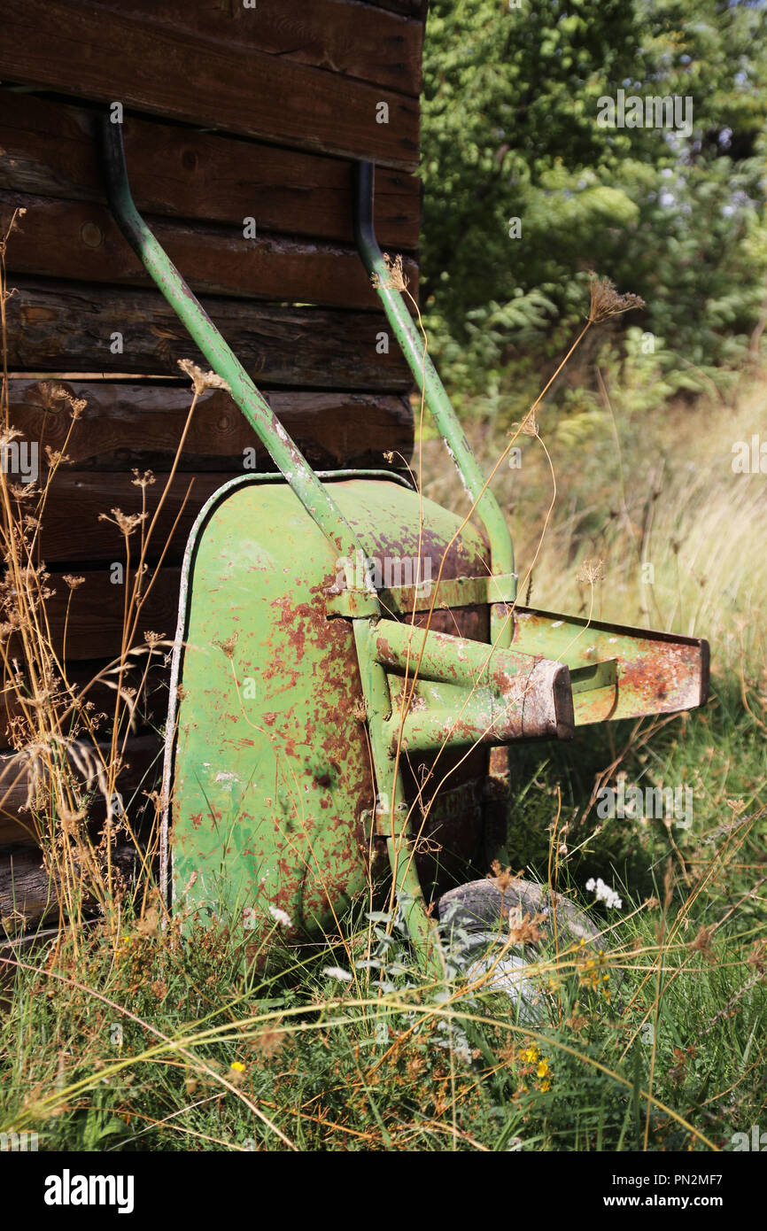 green iron wheelbarrow Stock Photo - Alamy