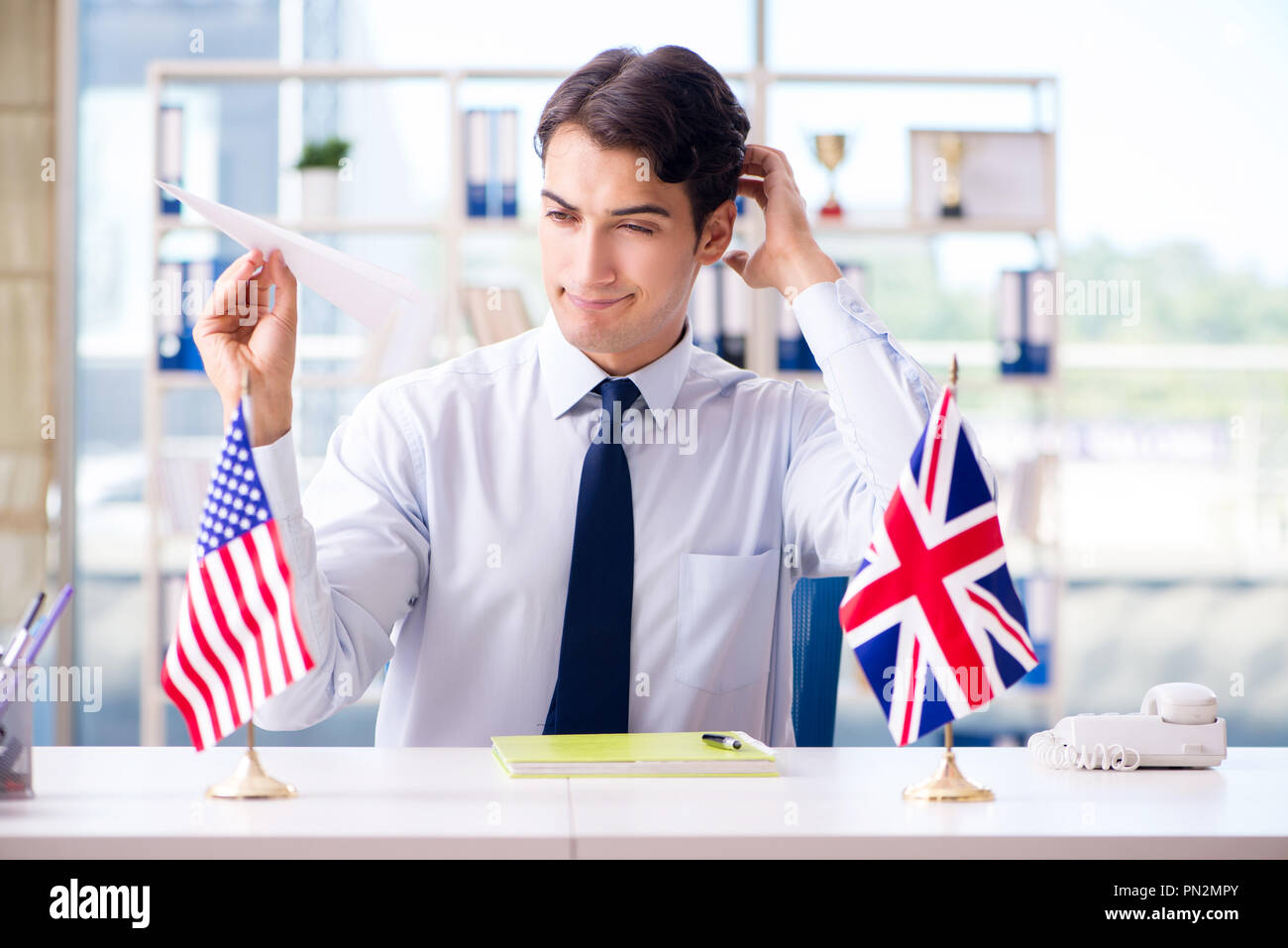 Sales agent working in travel agency Stock Photo - Alamy