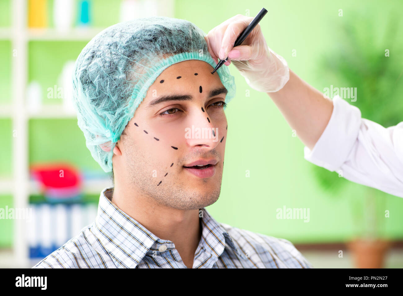 Plastic surgeon preparing for operation on man face Stock Photo - Alamy