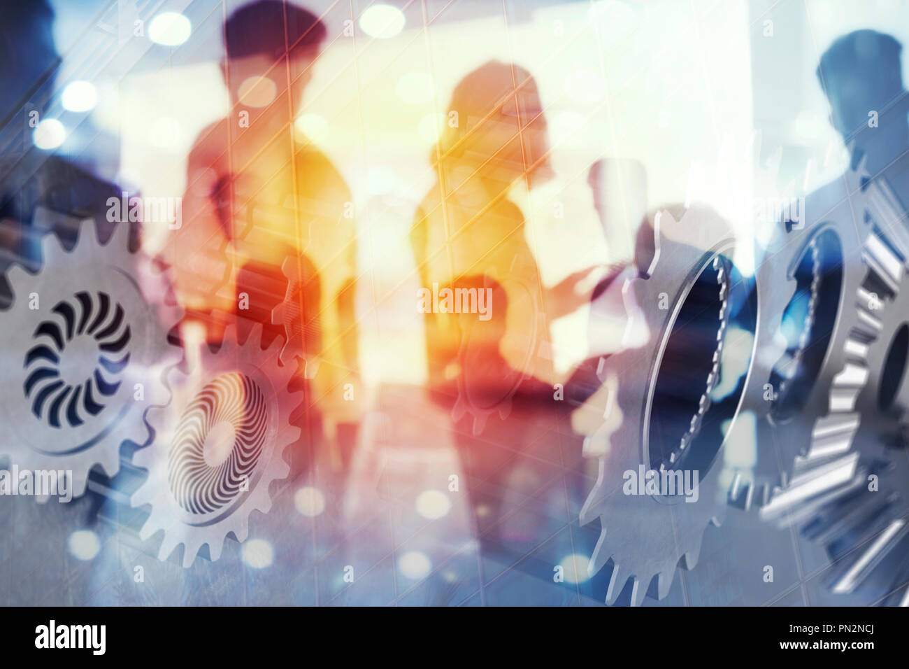Business people work together in office with gears system effects ...