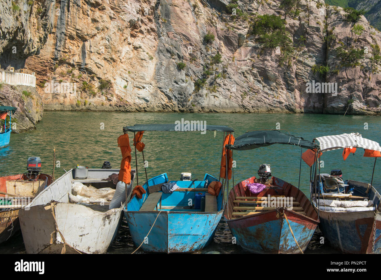 Old traditional fishing boats on the rivershore, Albania Stock Photo ...