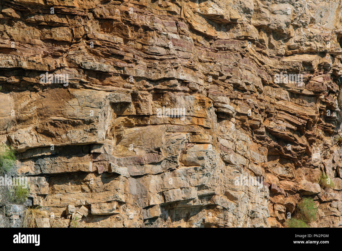 Natural background of solid rough stone wall Stock Photo - Alamy