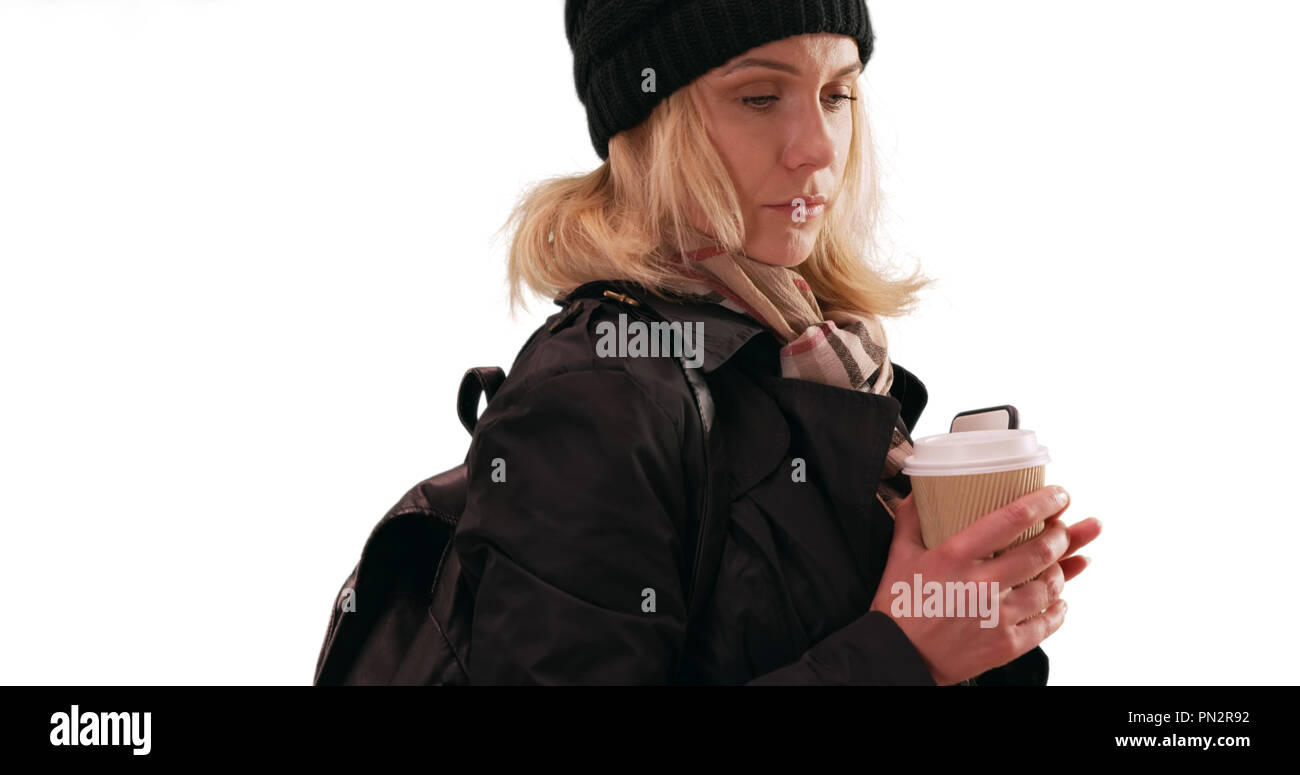 Nonchalant Caucasian female staring with sad expression on solid white ...