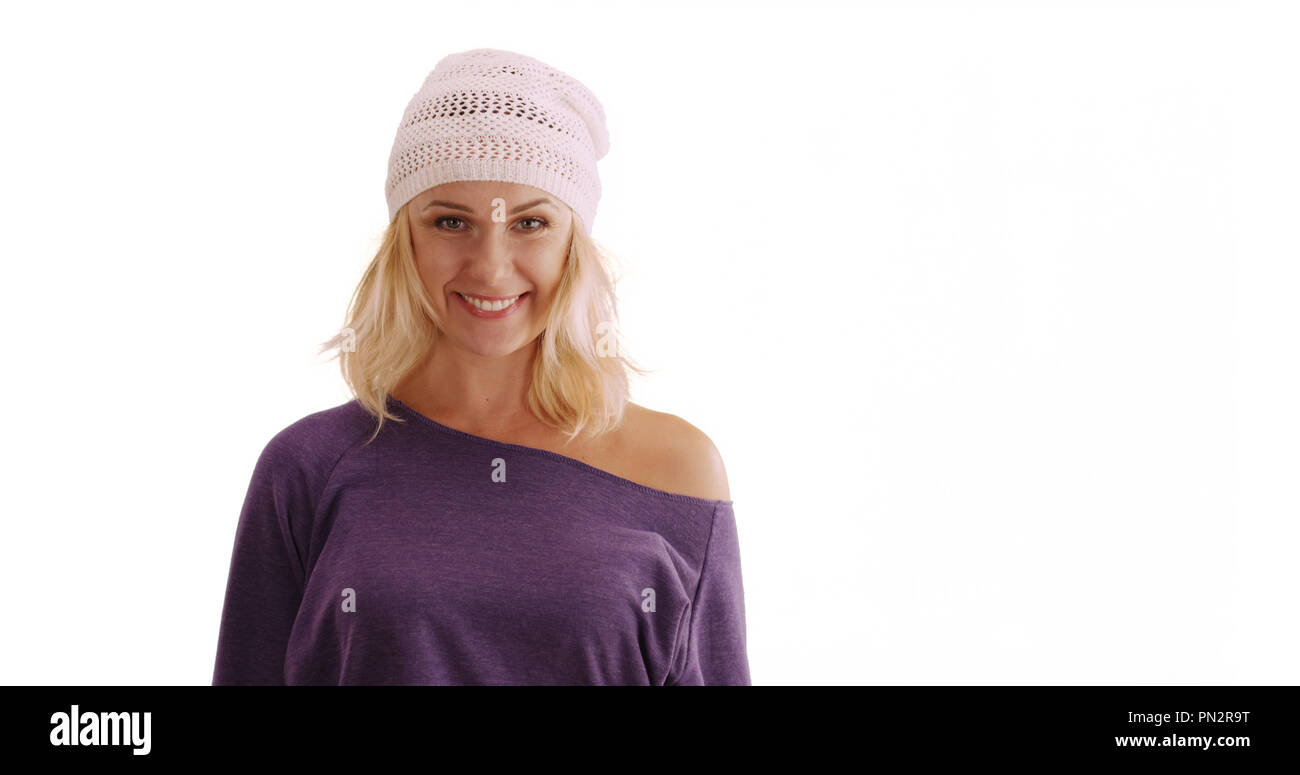 Portrait of joyful carefree white girl posing happily on solid white ...