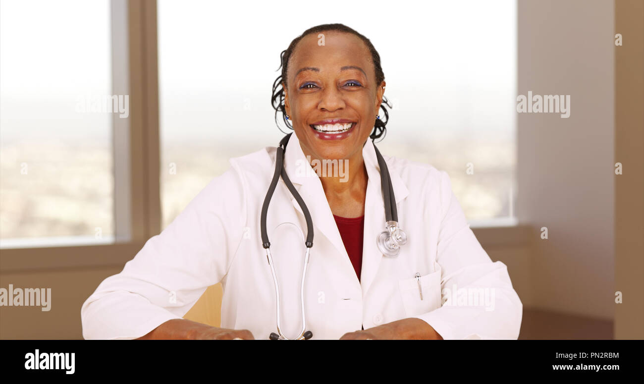Senior African doctor smiling at camera Stock Photo - Alamy