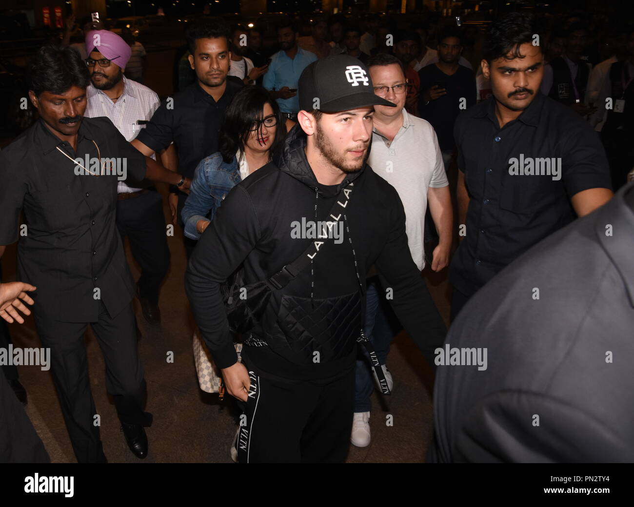 Nick Jonas arrives at Mumbai airport with his parents as they prepare ...