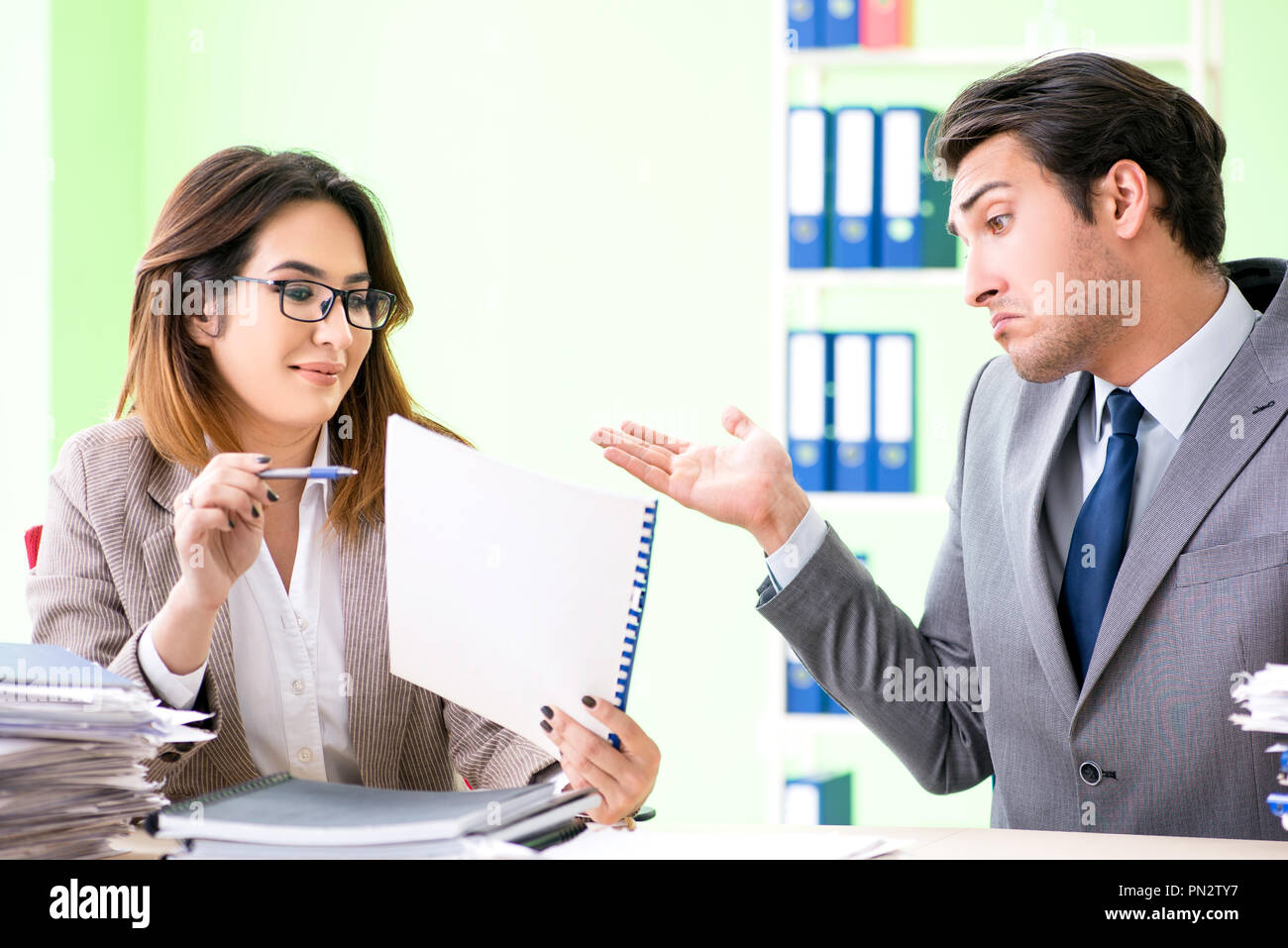 Two colleagues working in the office Stock Photo - Alamy