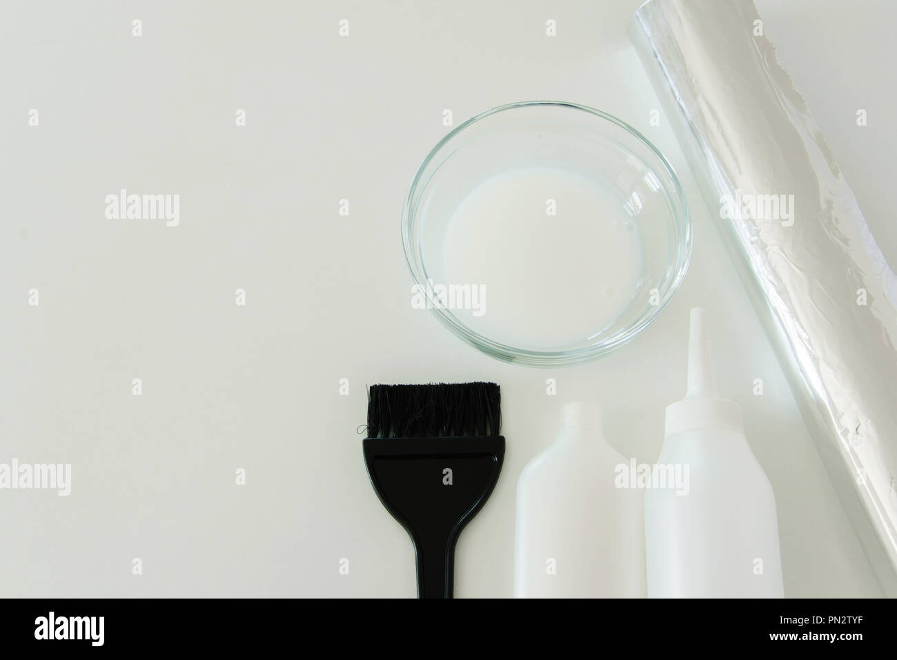 Hair dye tools on white background, space for text Stock Photo - Alamy