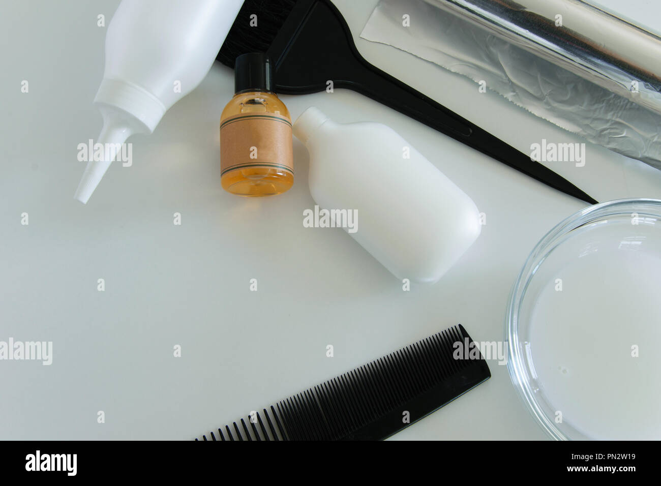 Hair dye tools on white background, space for text Stock Photo - Alamy