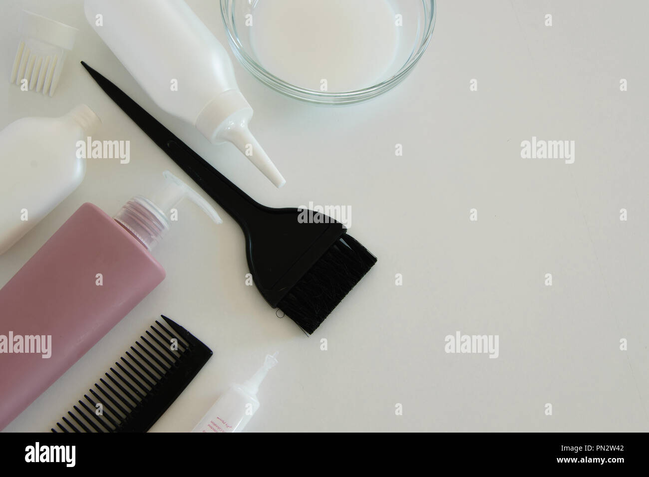 Hair dye tools on white background, space for text Stock Photo - Alamy