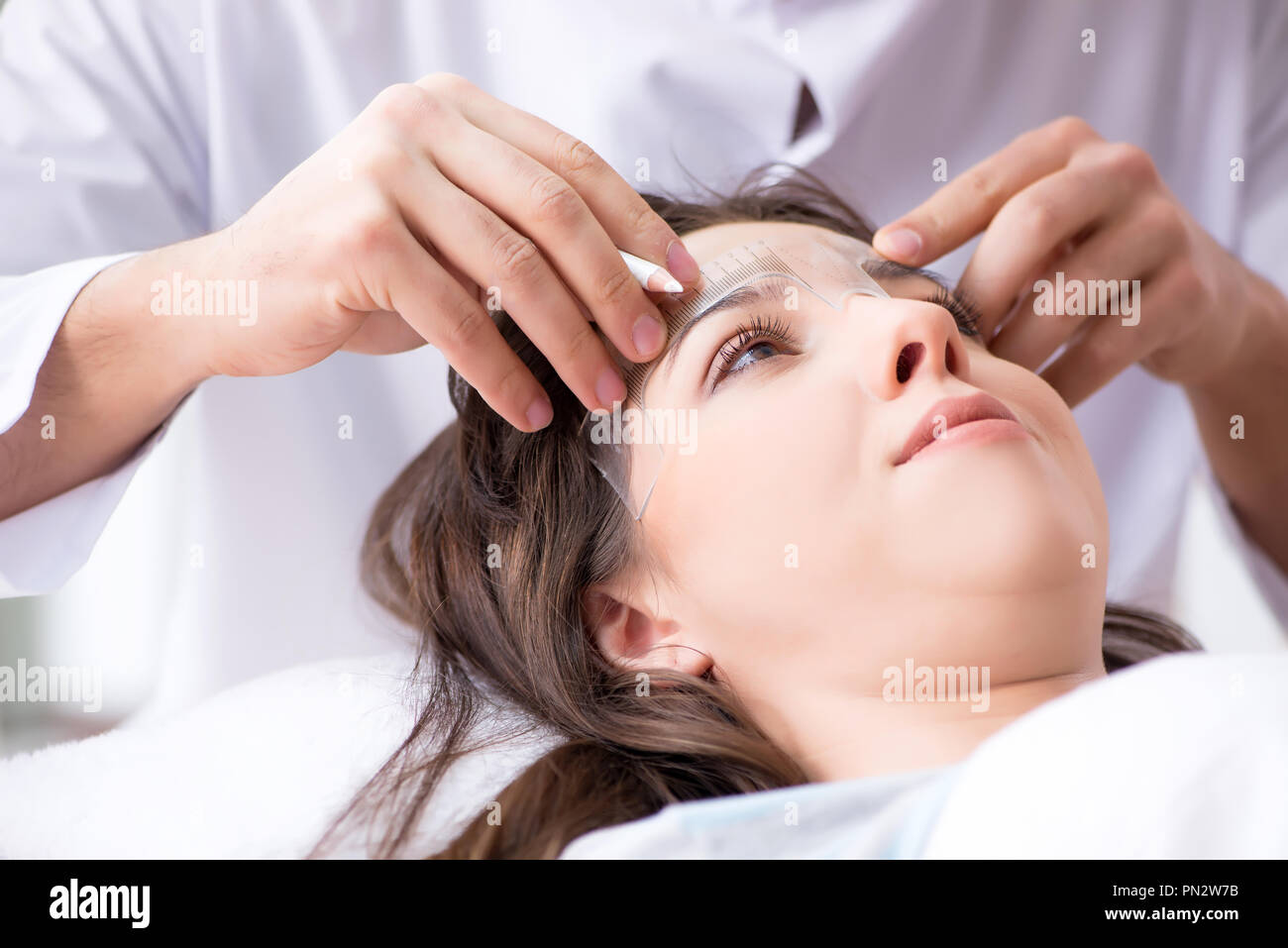 Doctor measuring patient's face before plastic surgery Stock Photo - Alamy