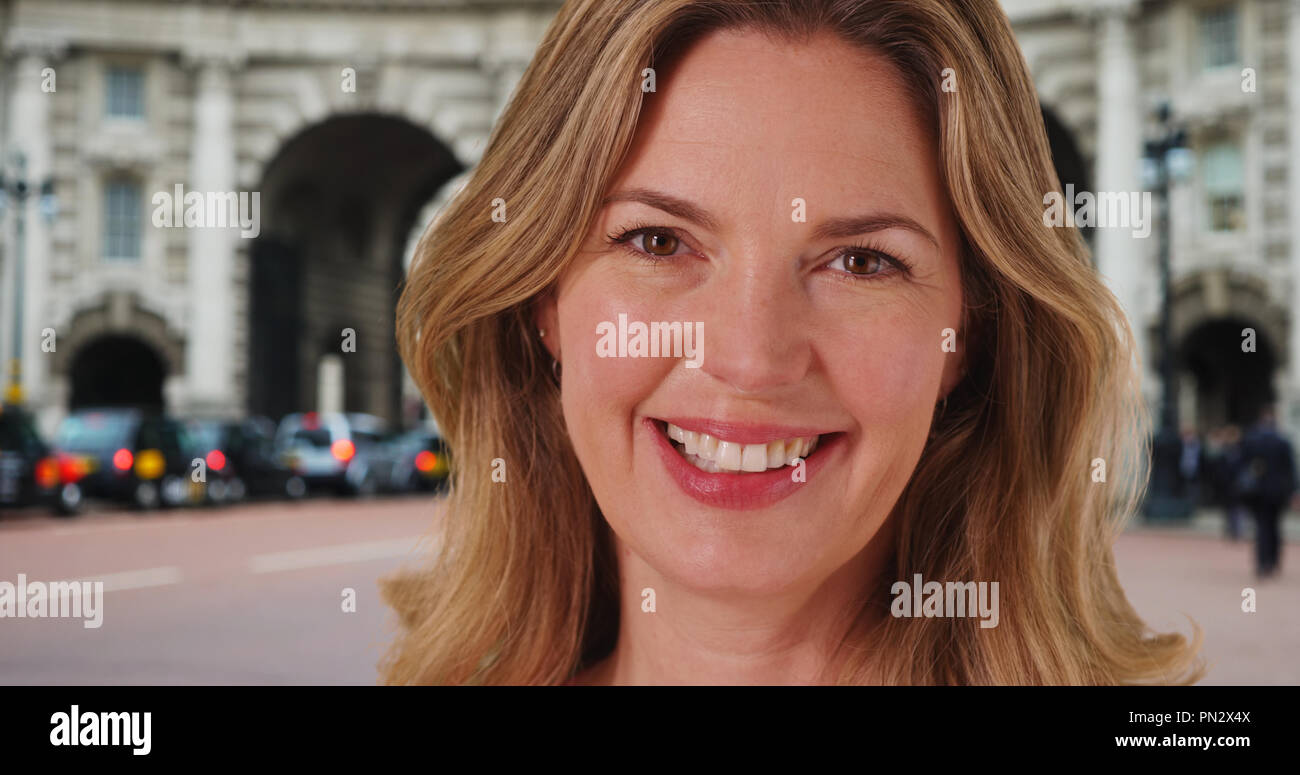 Cheerful blonde woman radiant smile hi-res stock photography and images ...