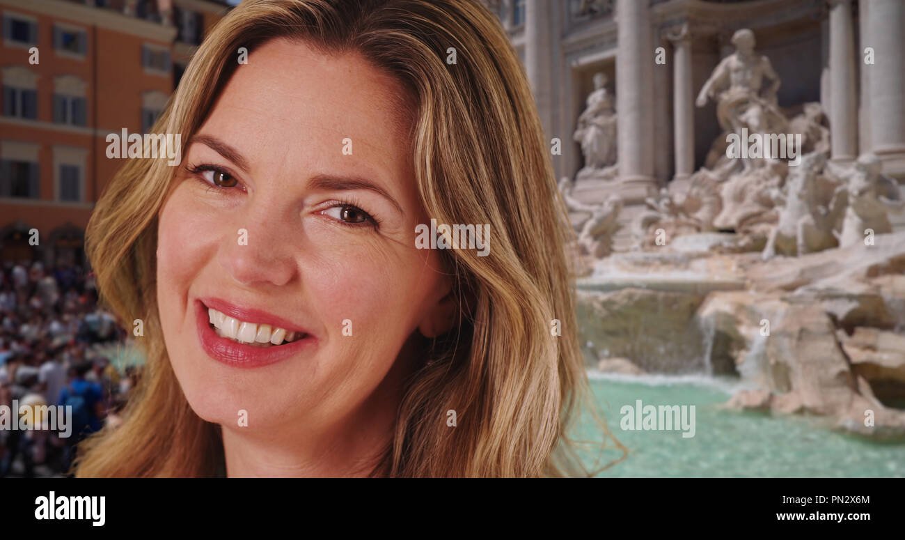 Caucasian woman at the Trevi Fountain laughing and smiling Stock Photo ...