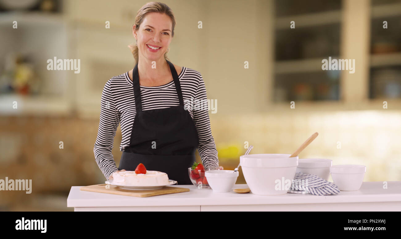 Woman presenting cake hi-res stock photography and images - Alamy