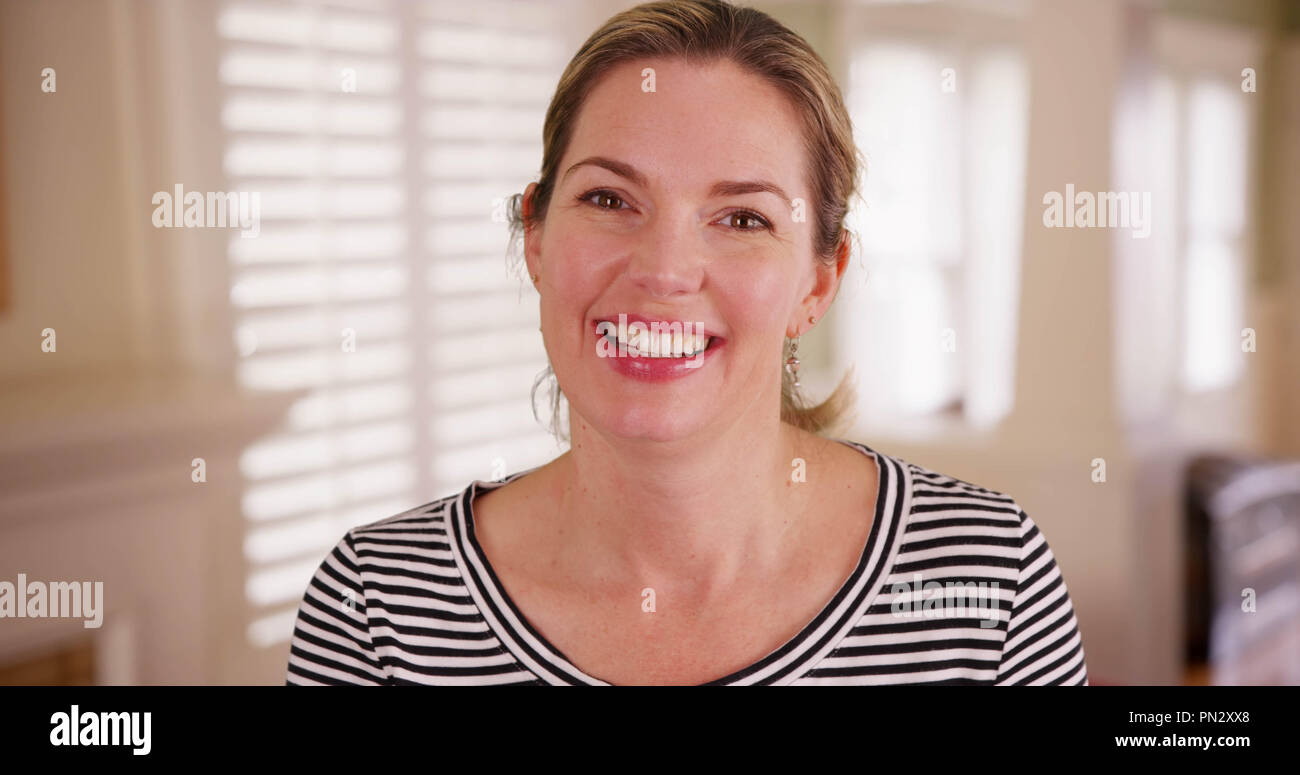 Close up of Caucasian woman video calling inside living room from POV ...