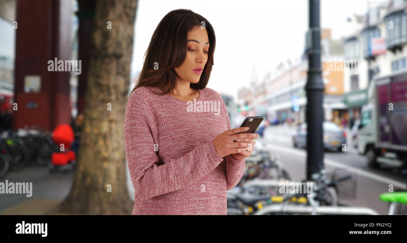 Pretty latin woman using hi-res stock photography and images - Alamy