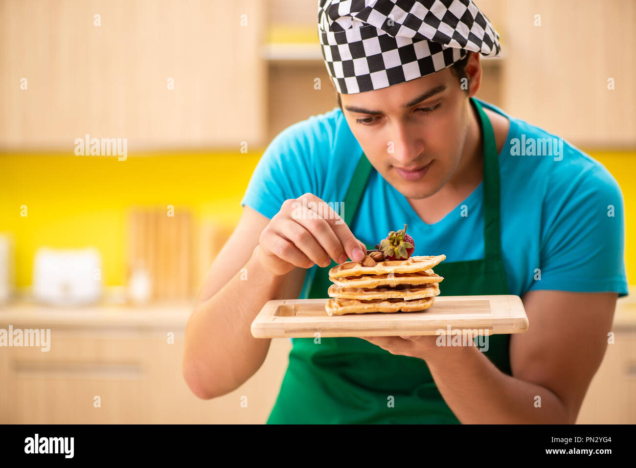 Man cook preparing cake in kitchen at home Stock Photo - Alamy