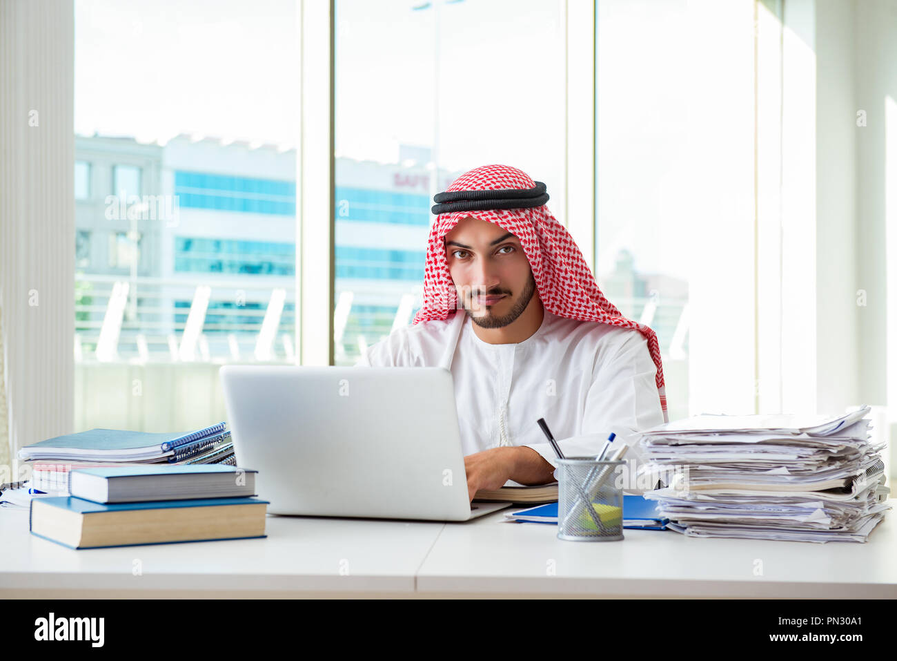 Arab businessman working in the office Stock Photo - Alamy