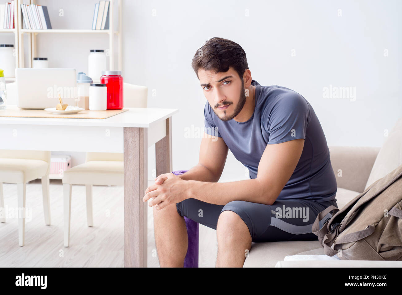 Young man getting ready for gym sports Stock Photo - Alamy