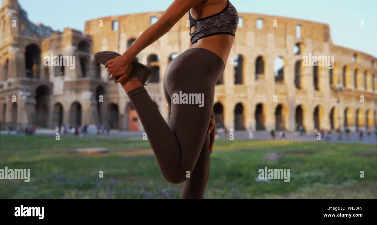 Close up of black woman athlete stretching in front of the Coliseum in ...