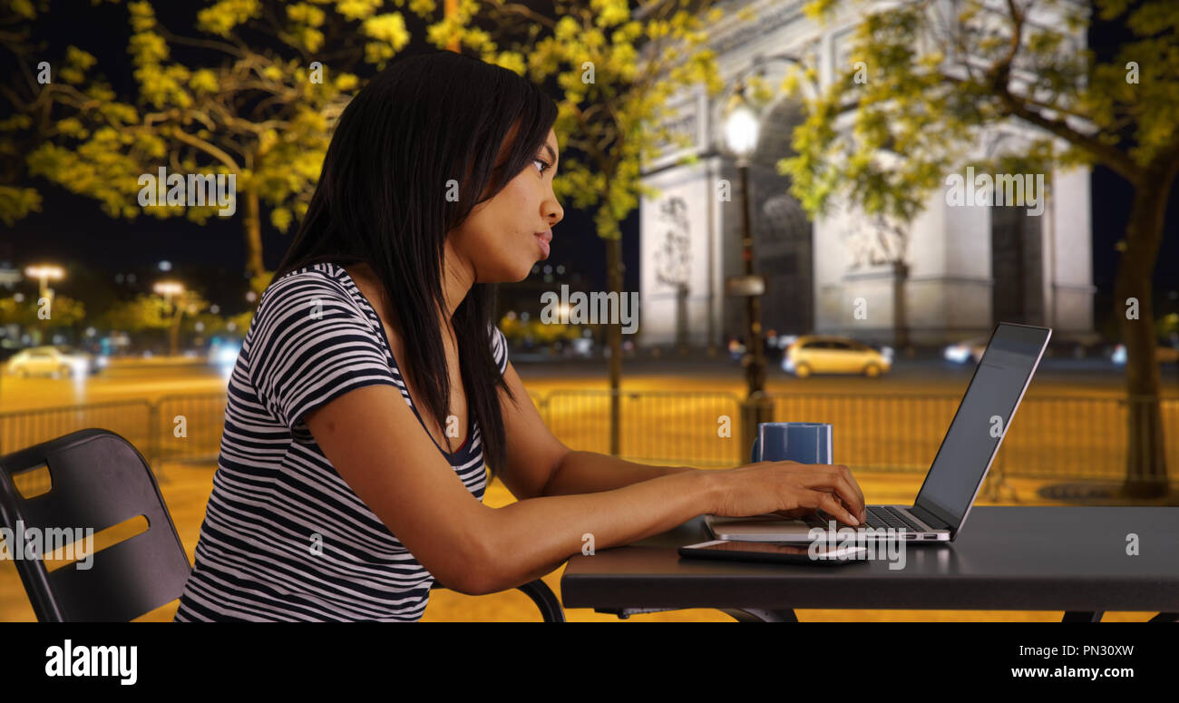 Business woman or student in Paris scrolling through her notebook ...