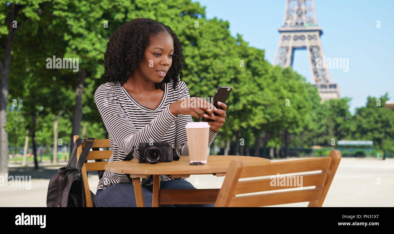 Black girl texting sitting table hi-res stock photography and images ...