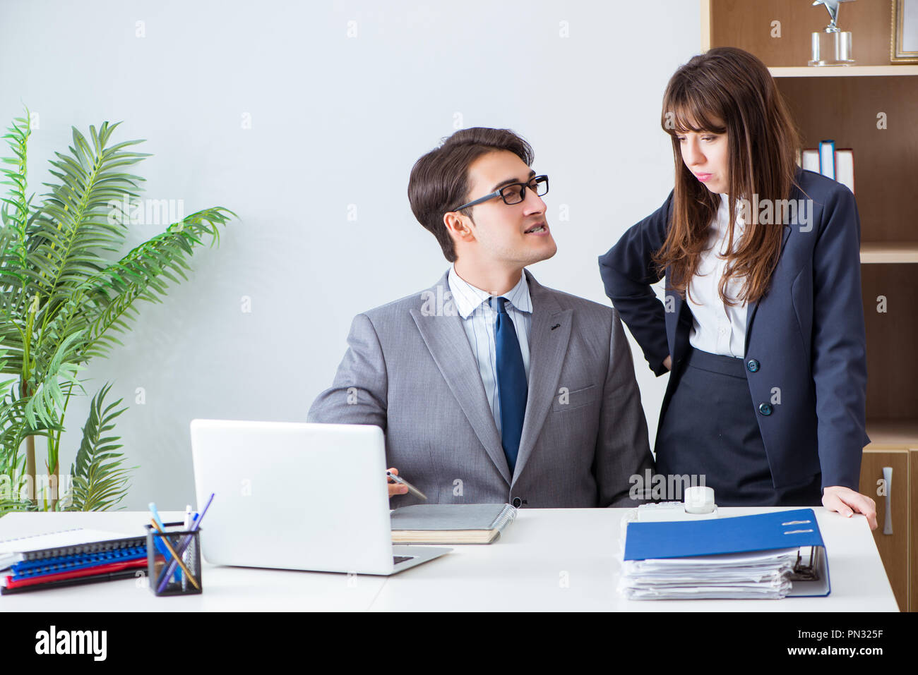 Boss and secretary in the office Stock Photo - Alamy