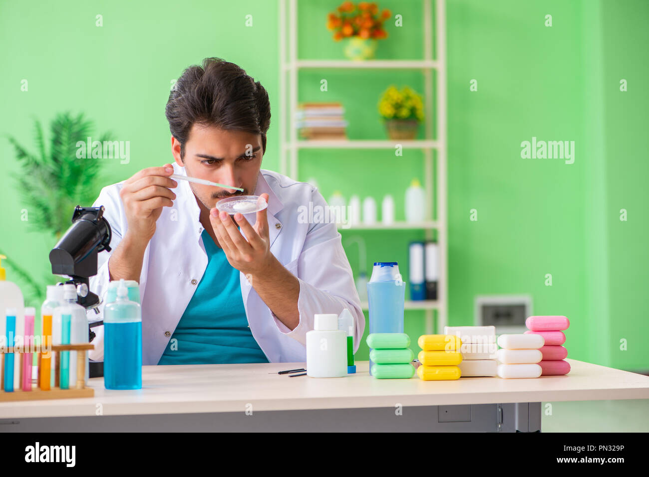 Chemist testing soap in the lab Stock Photo - Alamy
