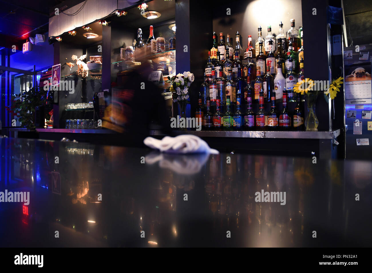 Bartender bottle behind bar hi-res stock photography and images - Alamy