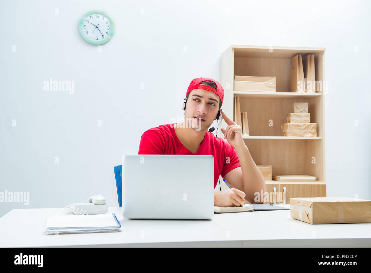 Call center worker at parcel distribution center in post office Stock ...