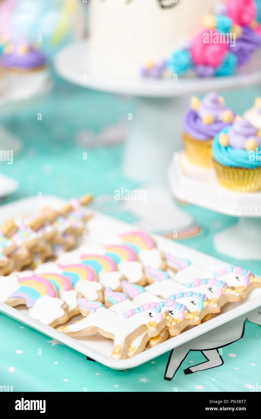 Unicorn sugar cookies on serving tray at little girl birthday party ...