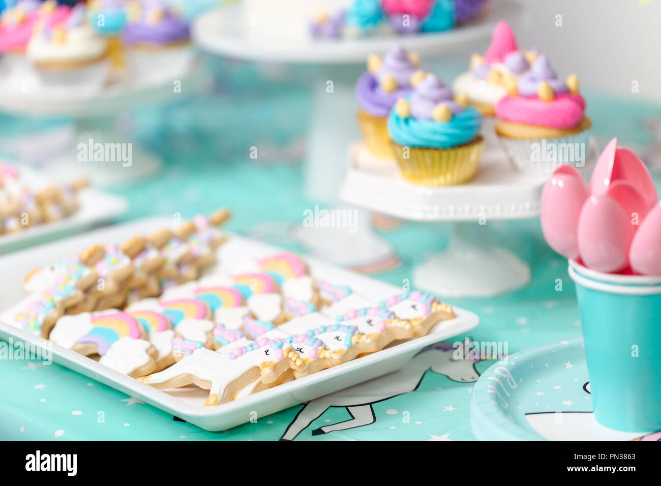 Unicorn sugar cookies on serving tray at little girl birthday party ...