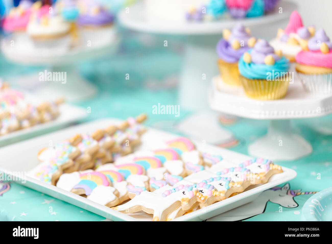 Unicorn sugar cookies on serving tray at little girl birthday party ...