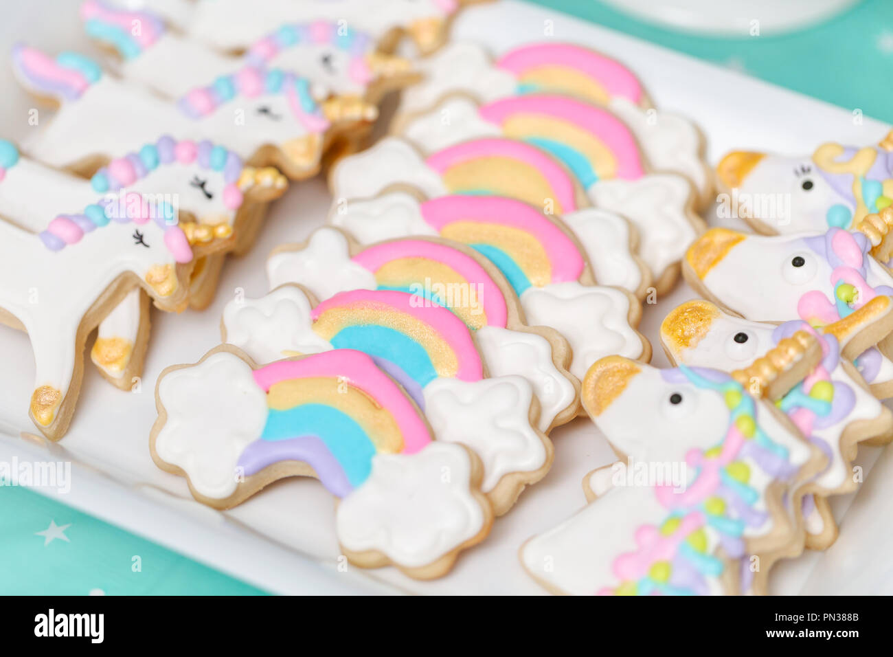 Unicorn sugar cookies on serving tray at little girl birthday party ...